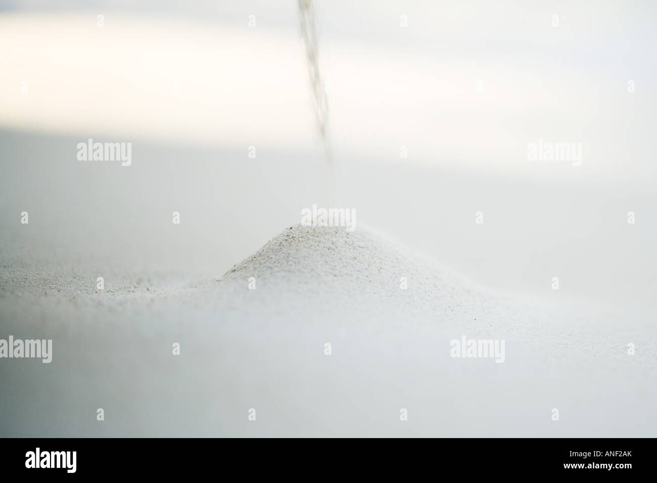 Sand falling onto mound Stock Photo - Alamy
