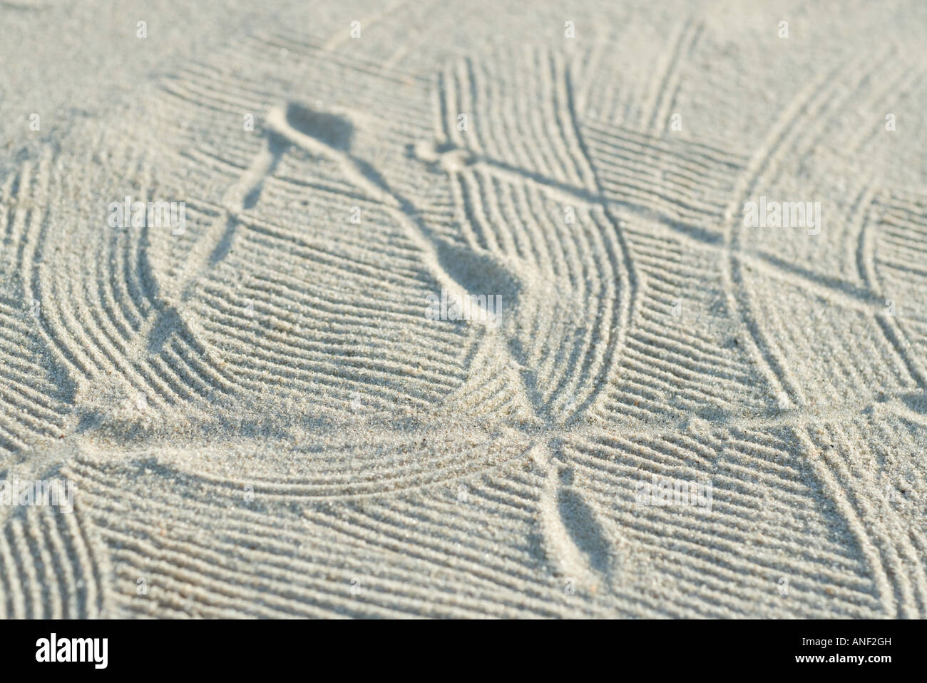 Pattern traced into sand, full frame Stock Photo - Alamy