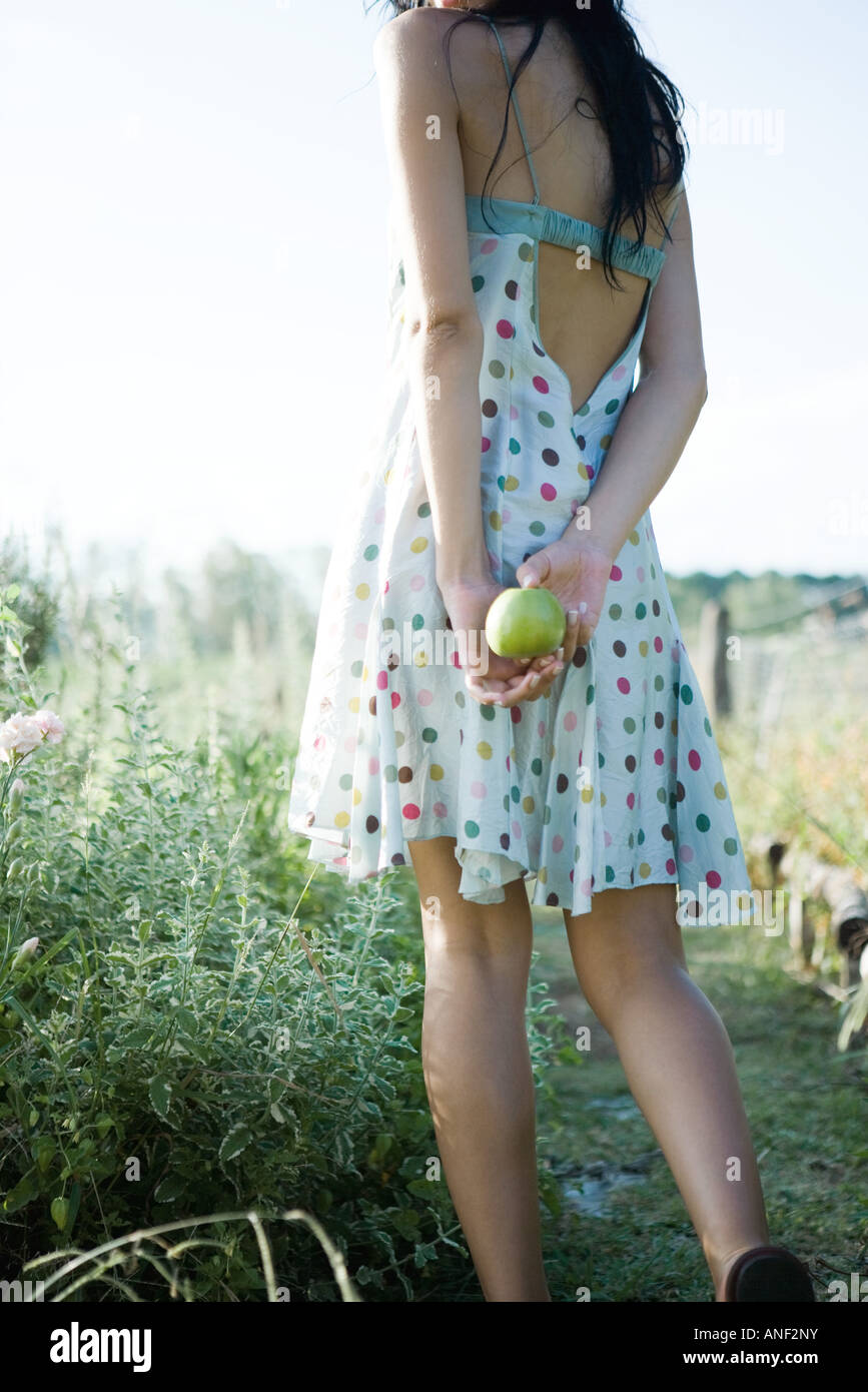 Hands behind back holding object hi-res stock photography and images ...