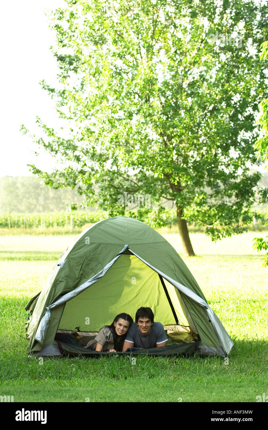 Friends in tent together Stock Photo - Alamy