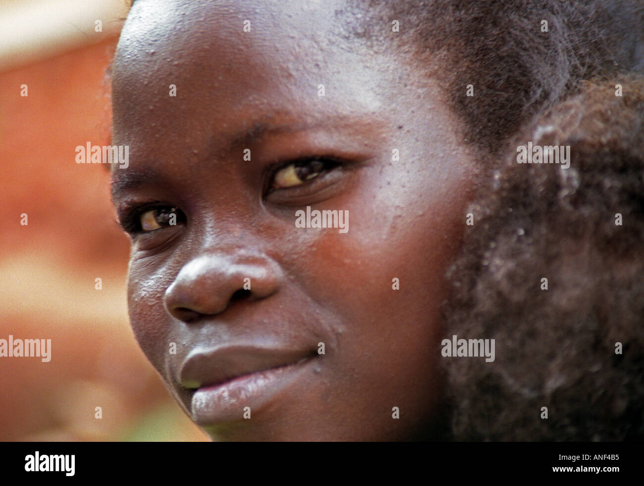 Powerful portrait of black African child & mother glancing intensively ...