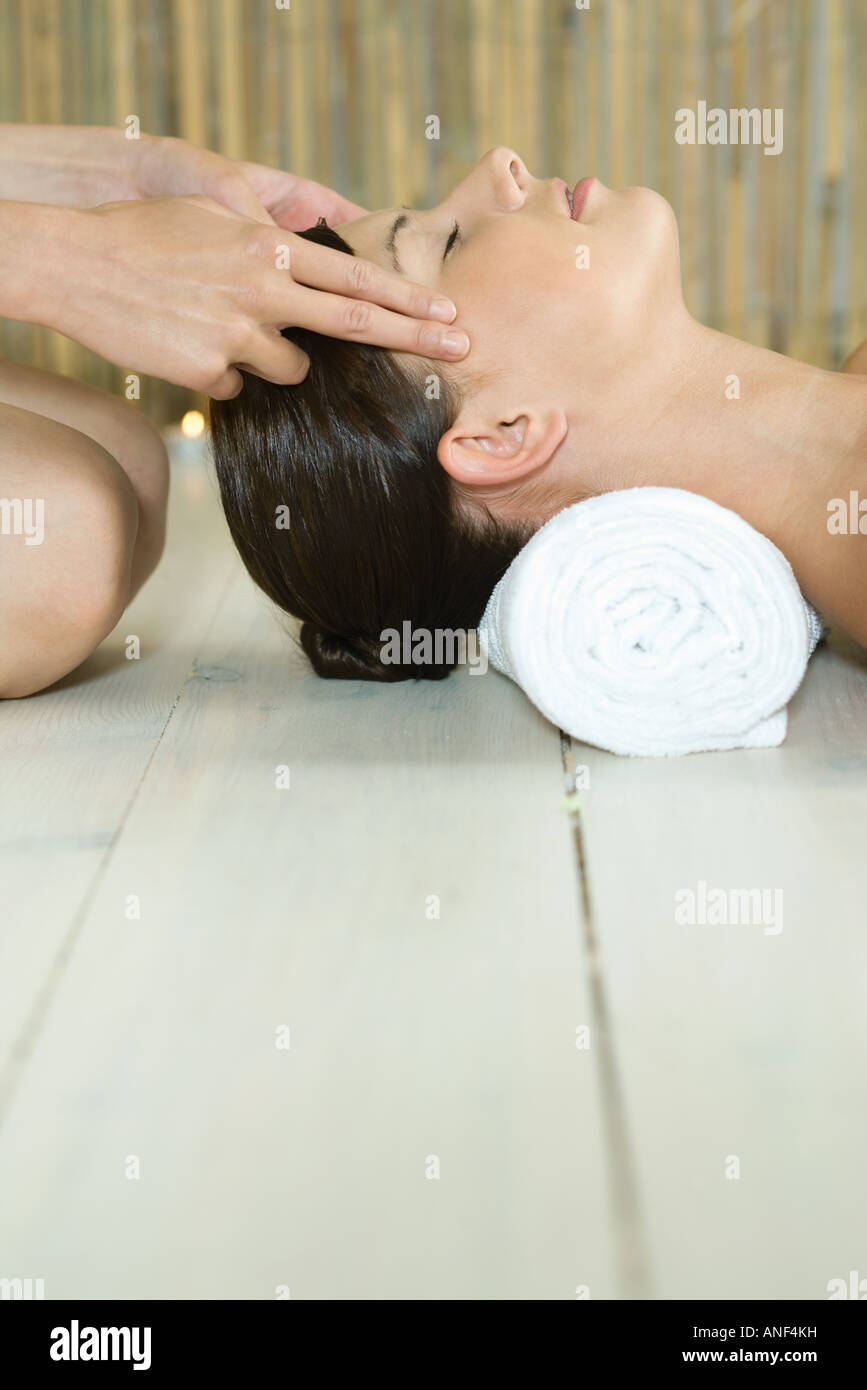 Young woman receiving head massage Stock Photo - Alamy