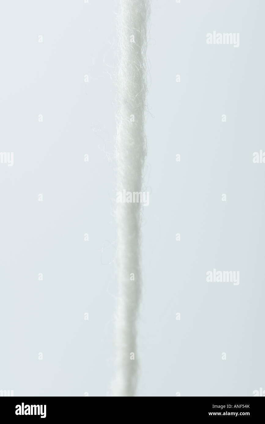 White cotton twisted into a string, close-up Stock Photo - Alamy