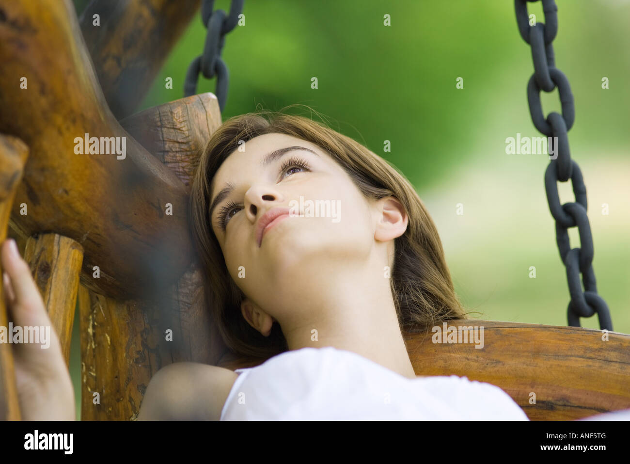 Young woman lying on swing, close-up Stock Photo - Alamy