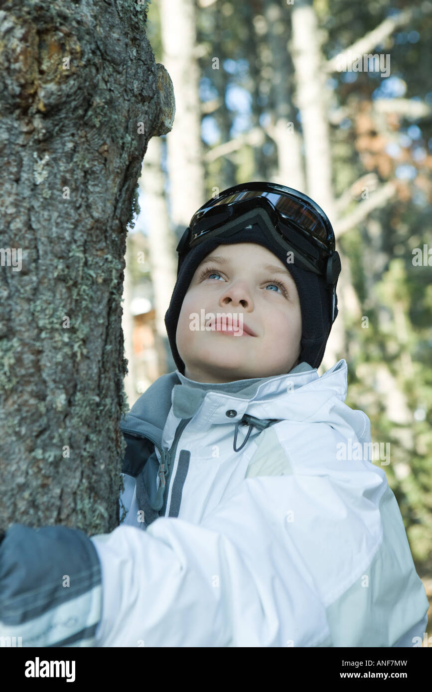 Boy hugging tree Stock Photo - Alamy