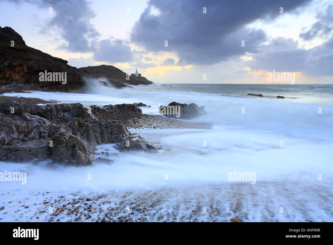 "Bracelet bay" "Gower Peninsula" Mumbles lighthouse, backwash on pebble ...