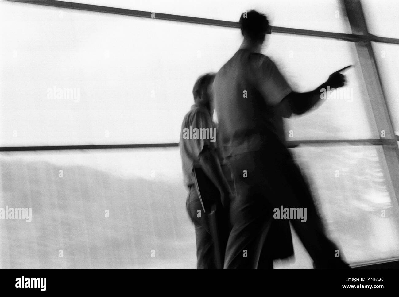 managers in move in front of glass facade Stock Photo - Alamy