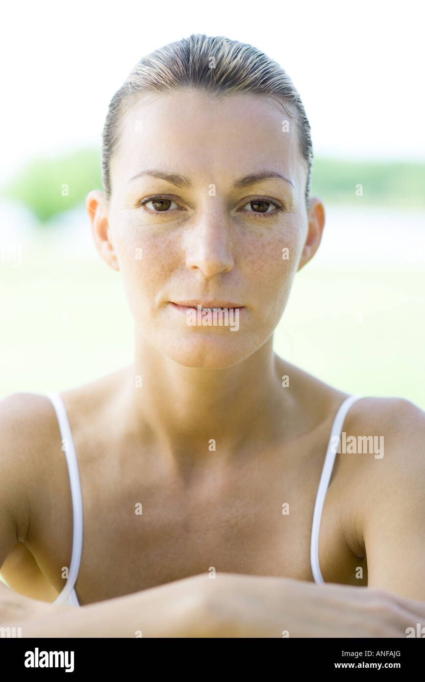 Woman wearing tank top, hair back, portrait Stock Photo - Alamy