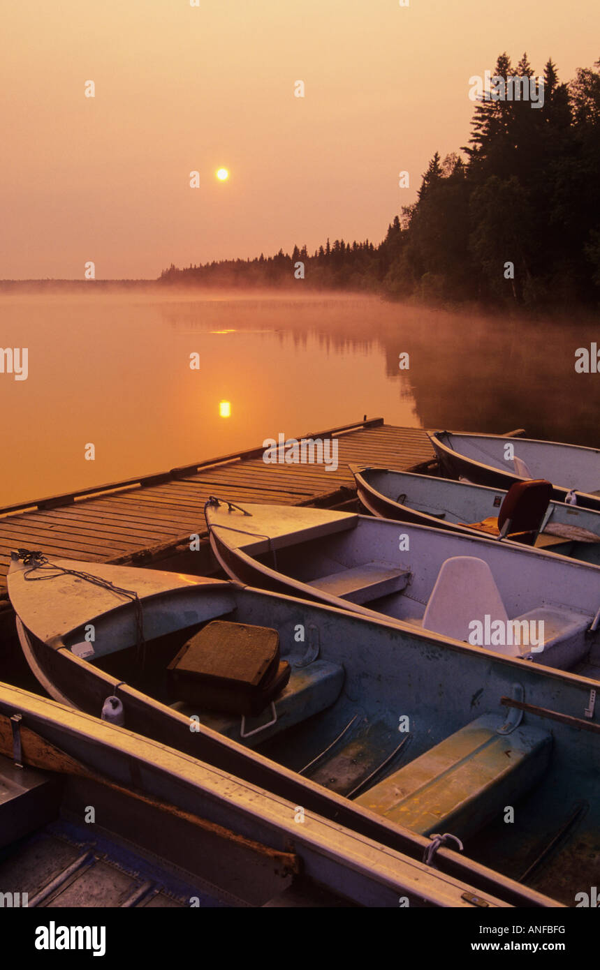 Boats at sunrise, childs lake, duck mountain Provincial Park, manitoba ...