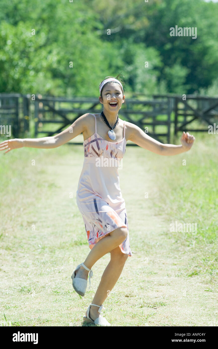 Woman running jumping fence hi-res stock photography and images - Alamy