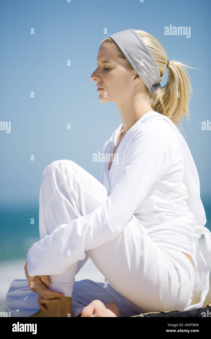 Clasping her knee hi-res stock photography and images - Alamy
