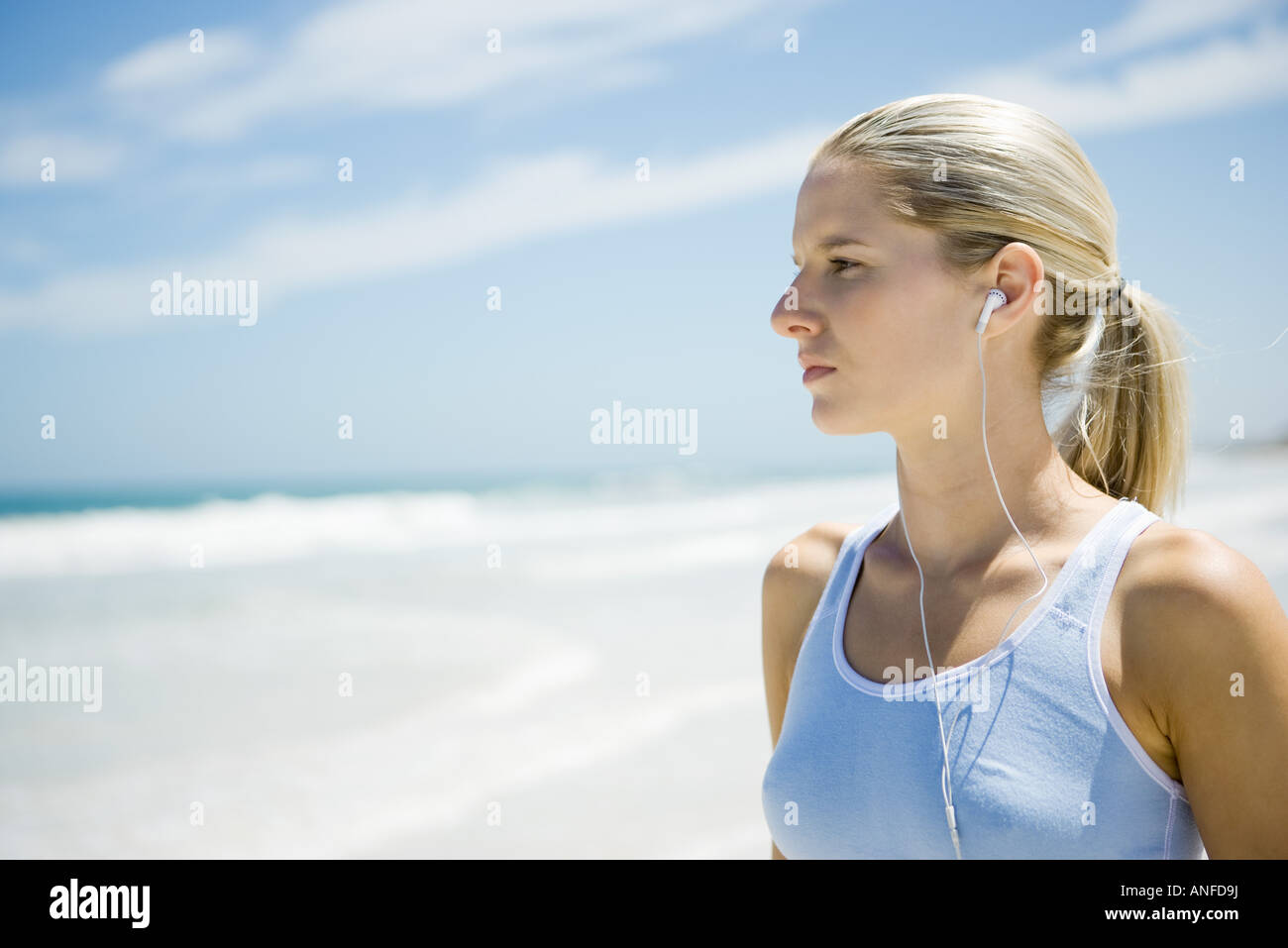 Back view woman wearing earbuds hi-res stock photography and images - Alamy