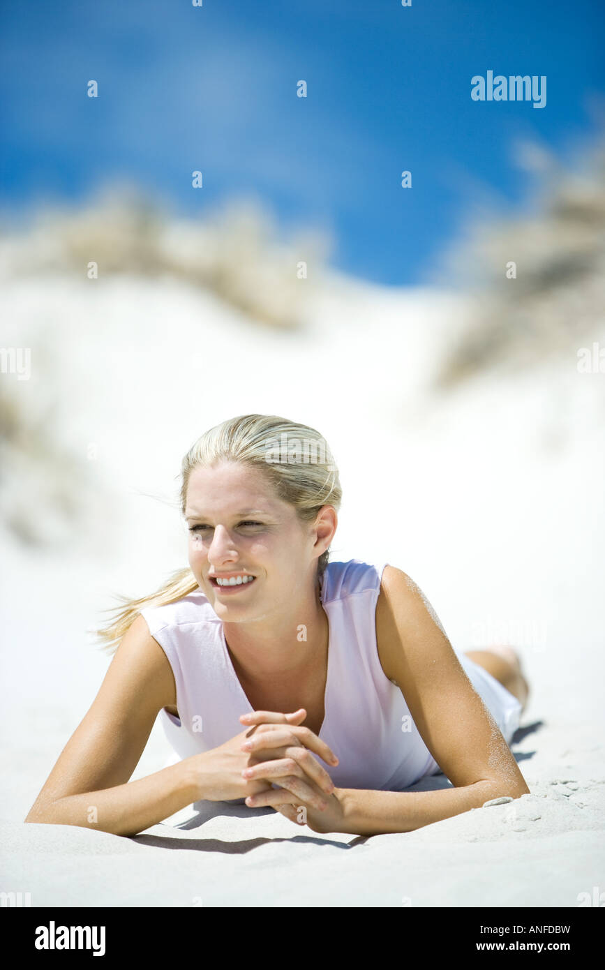 Woman lying on stomach beach hi-res stock photography and images - Alamy