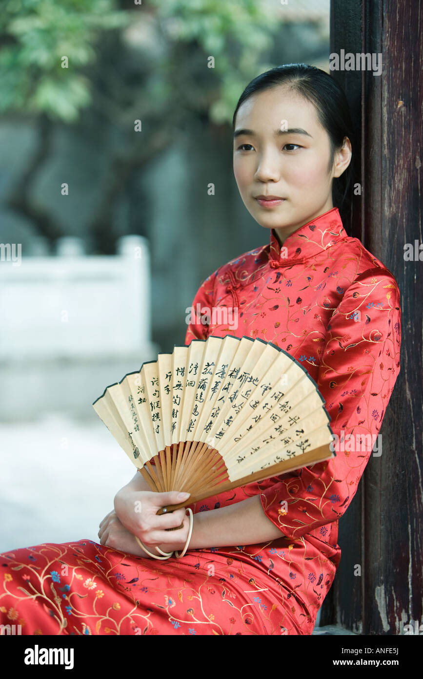 Young woman wearing traditional Chinese clothing, holding fan, portrait ...