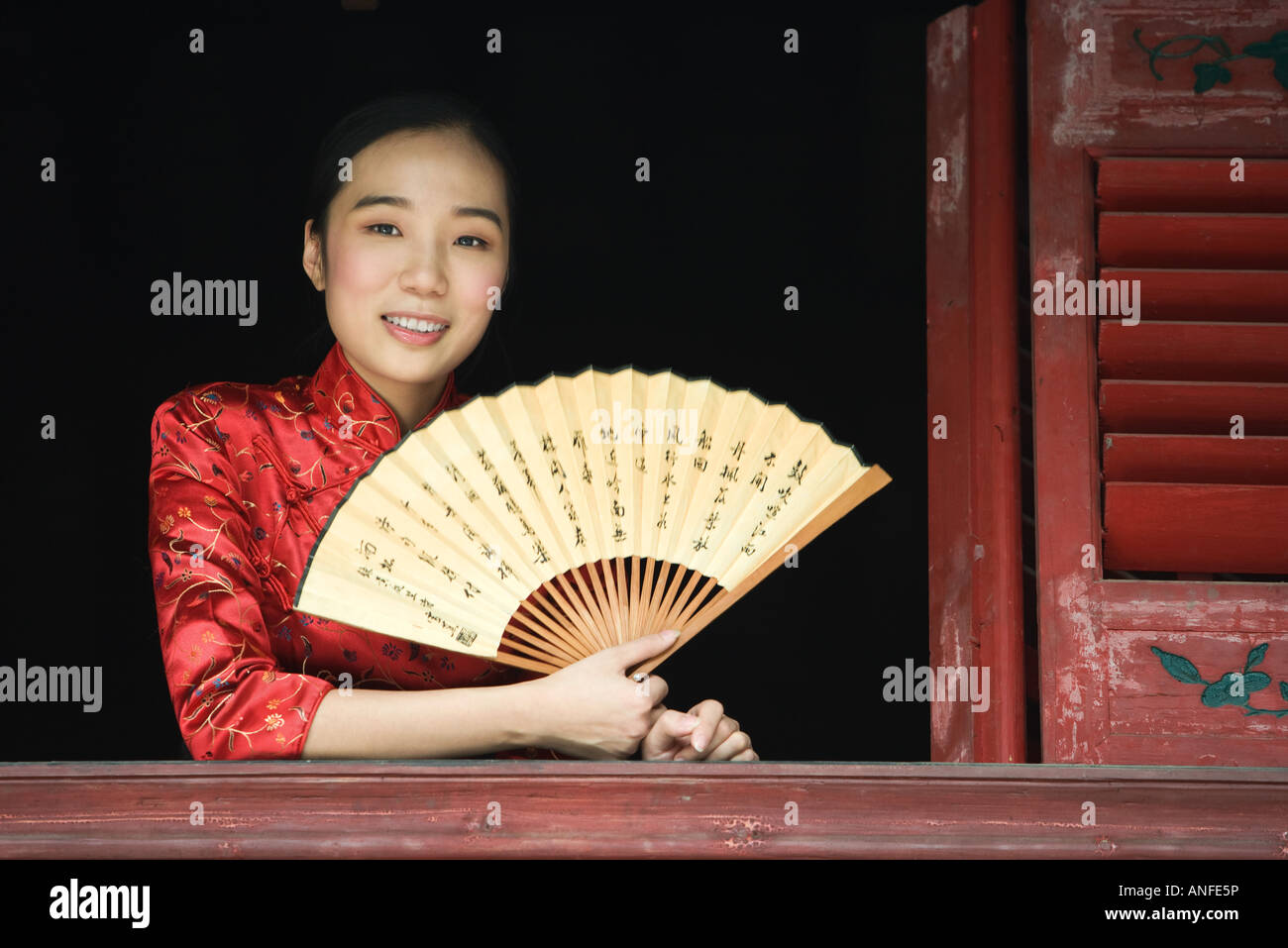 Young woman wearing traditional Chinese clothing, holding fan Stock ...