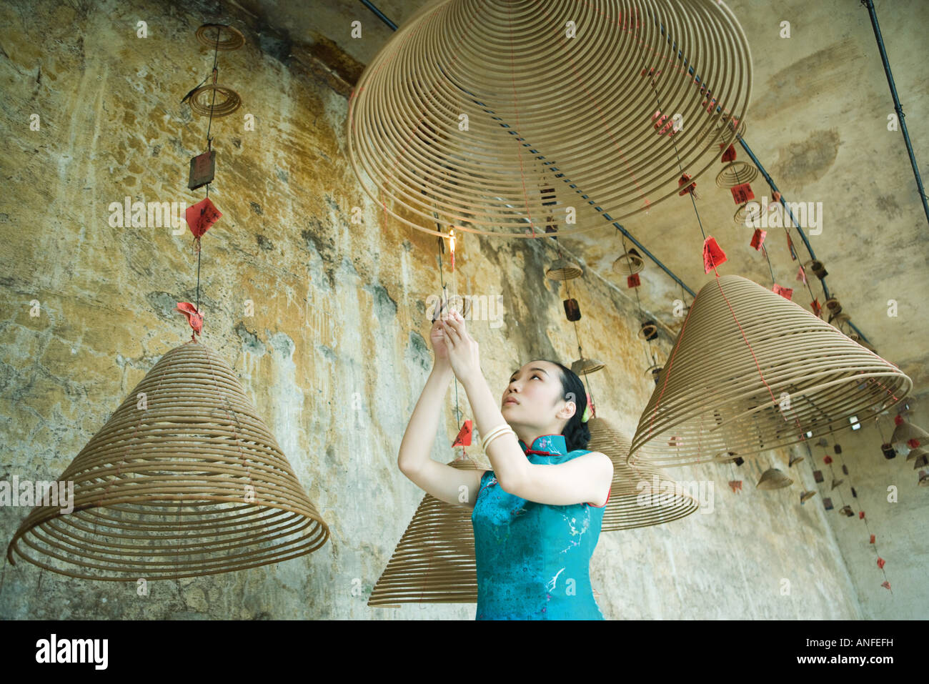 Young woman wearing traditional Chinese clothing, lighting spiral of ...