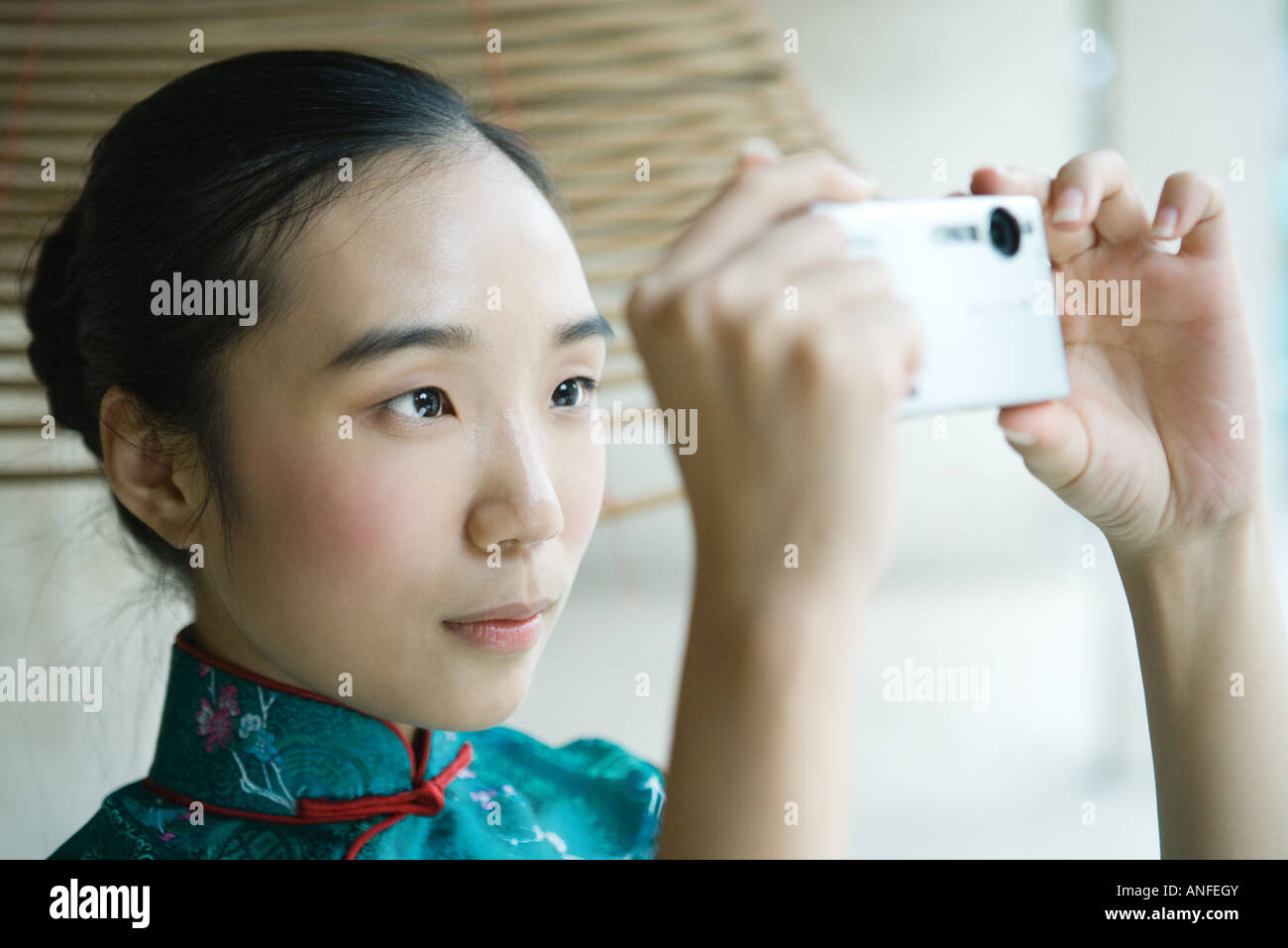Young chinese woman taking photos hi-res stock photography and images ...