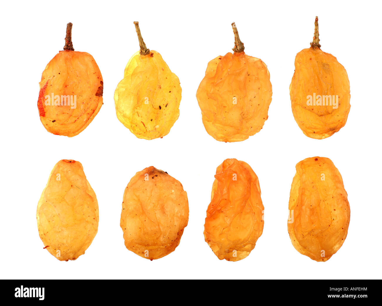 Group yellow raisin isolated on white background Stock Photo - Alamy