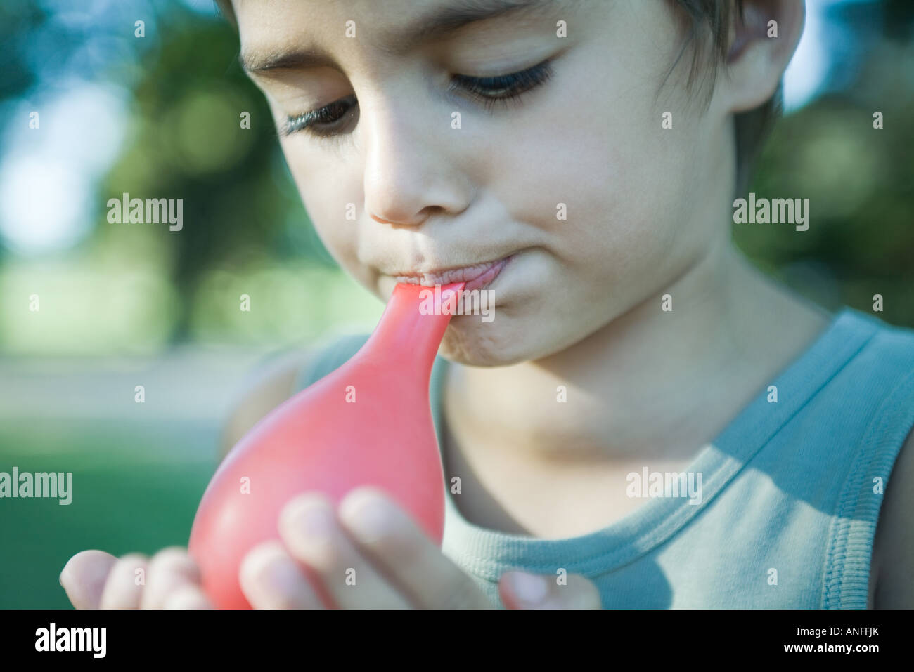 Boy Blowing Up Red Balloon High Resolution Stock Photography and Images ...