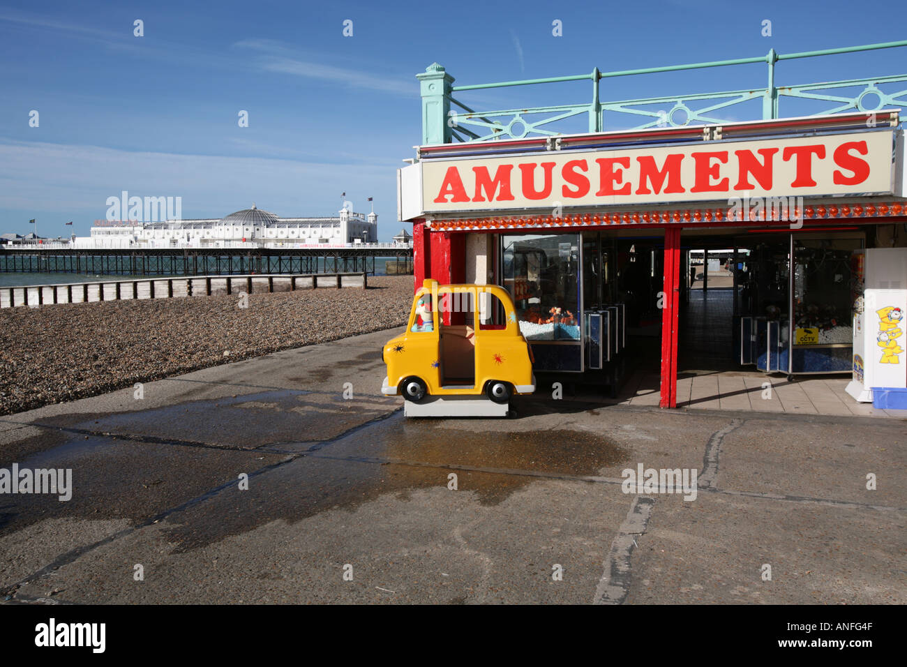 Amusement arcade on Brighton beach, with Brighton Pier (formally Palace ...