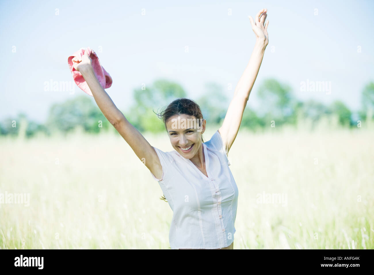 Woman holds arms raised in the air hi-res stock photography and images ...