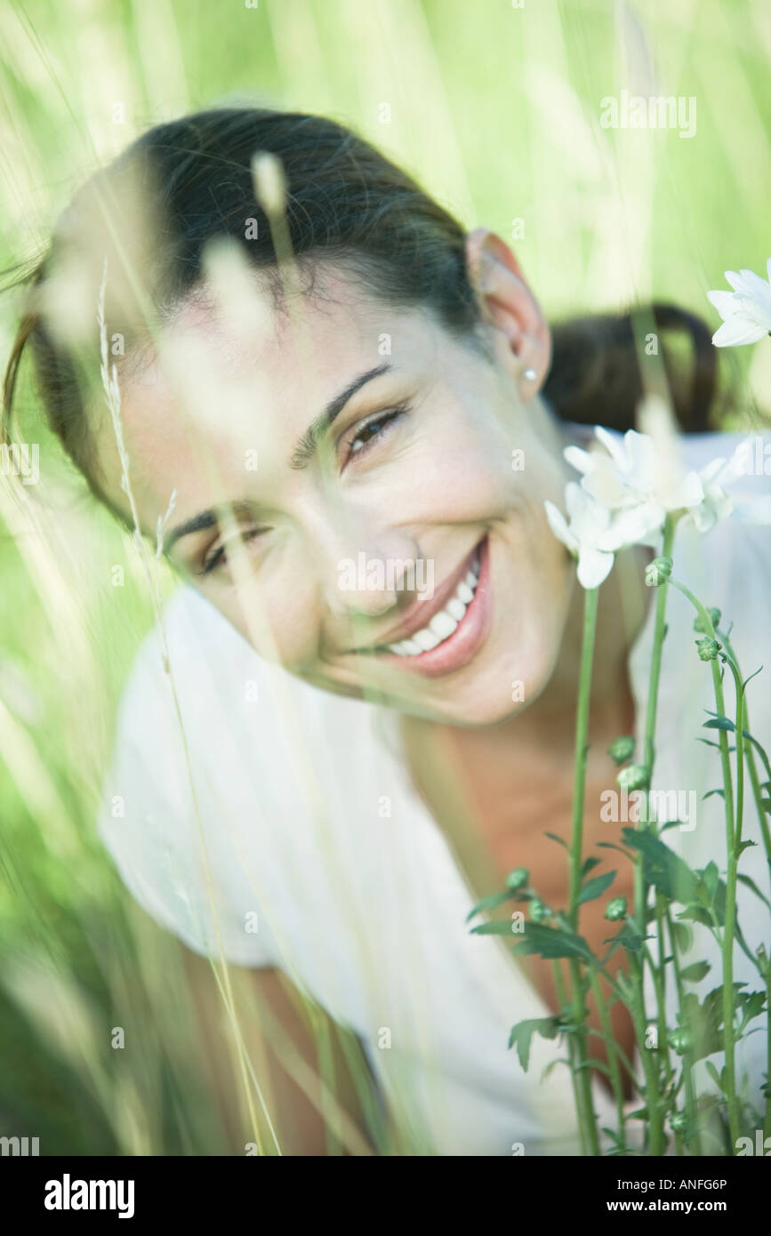 Woman in field, smiling at camera, portrait Stock Photo - Alamy
