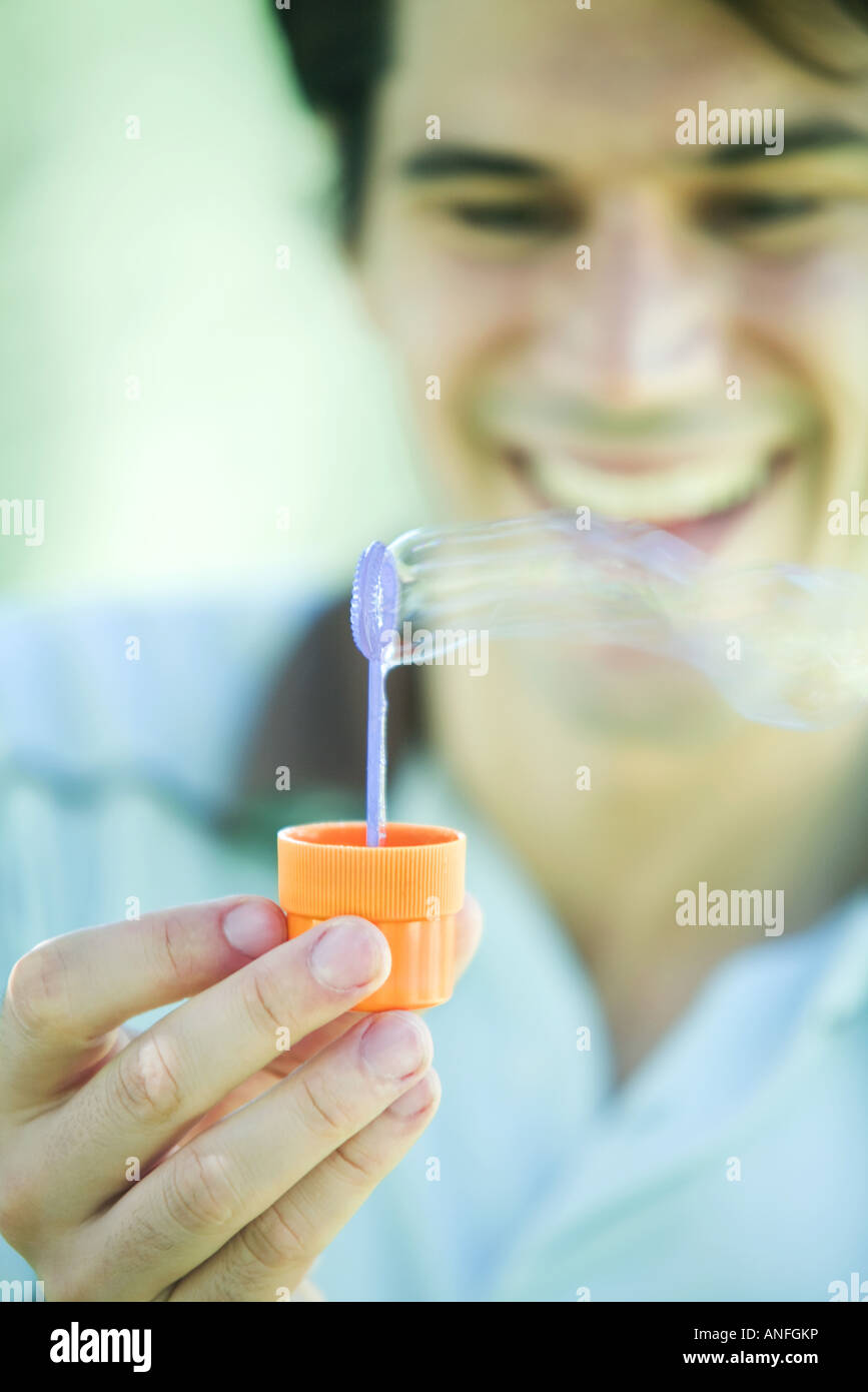 Man blowing bubbles Stock Photo - Alamy