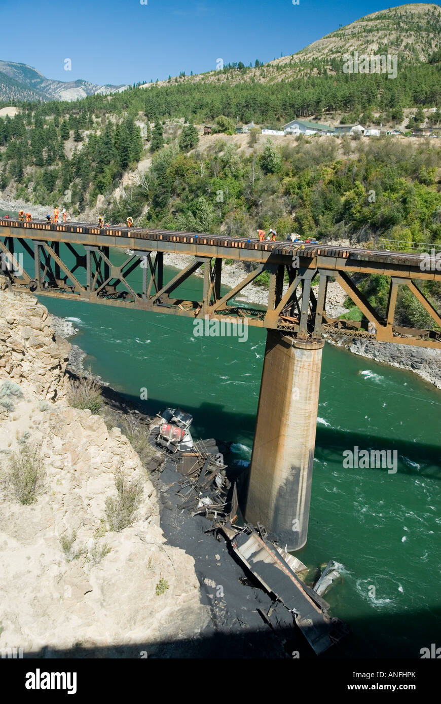 A canadian national train derailed on july 31, 2006 lies below a bridge ...
