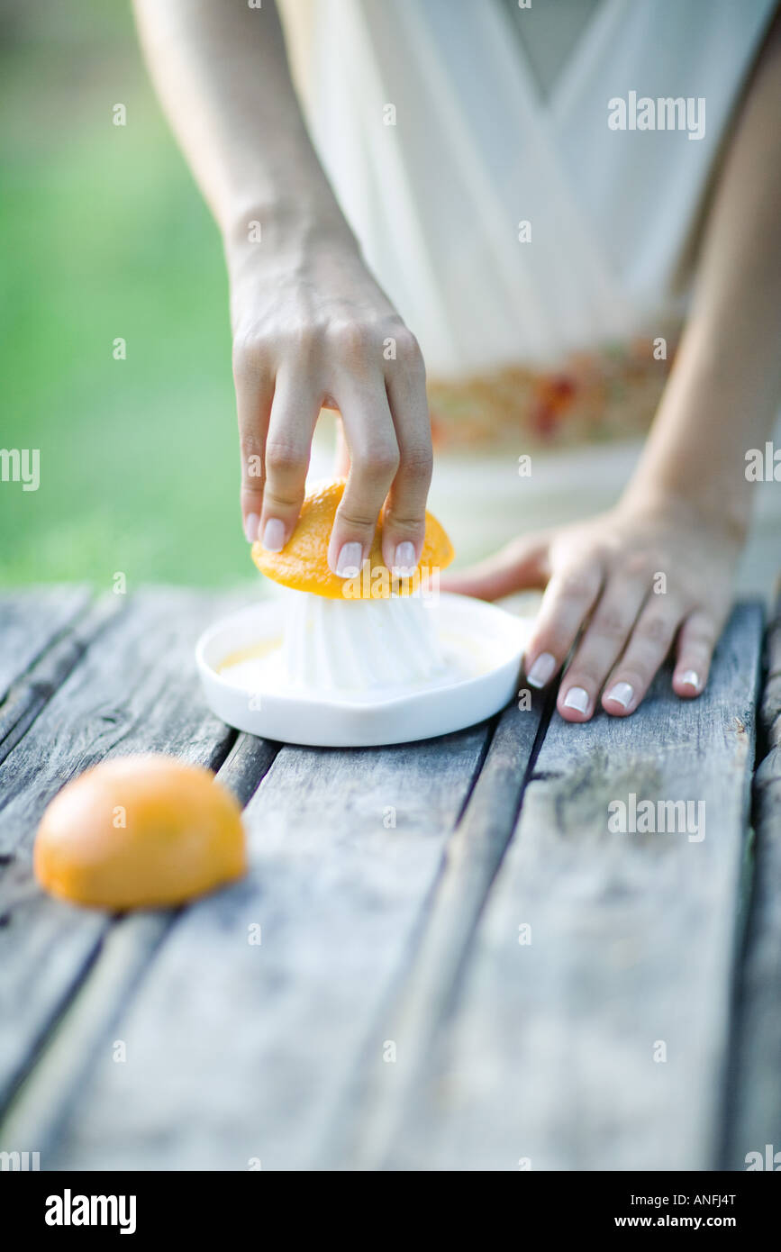 Woman pressing oranges hi-res stock photography and images - Alamy