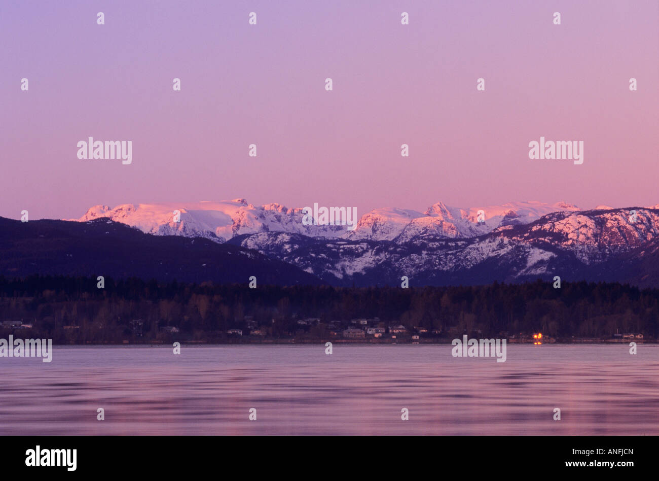 Early morning light on Comox Bay with Beaufort mountains and Comox ...