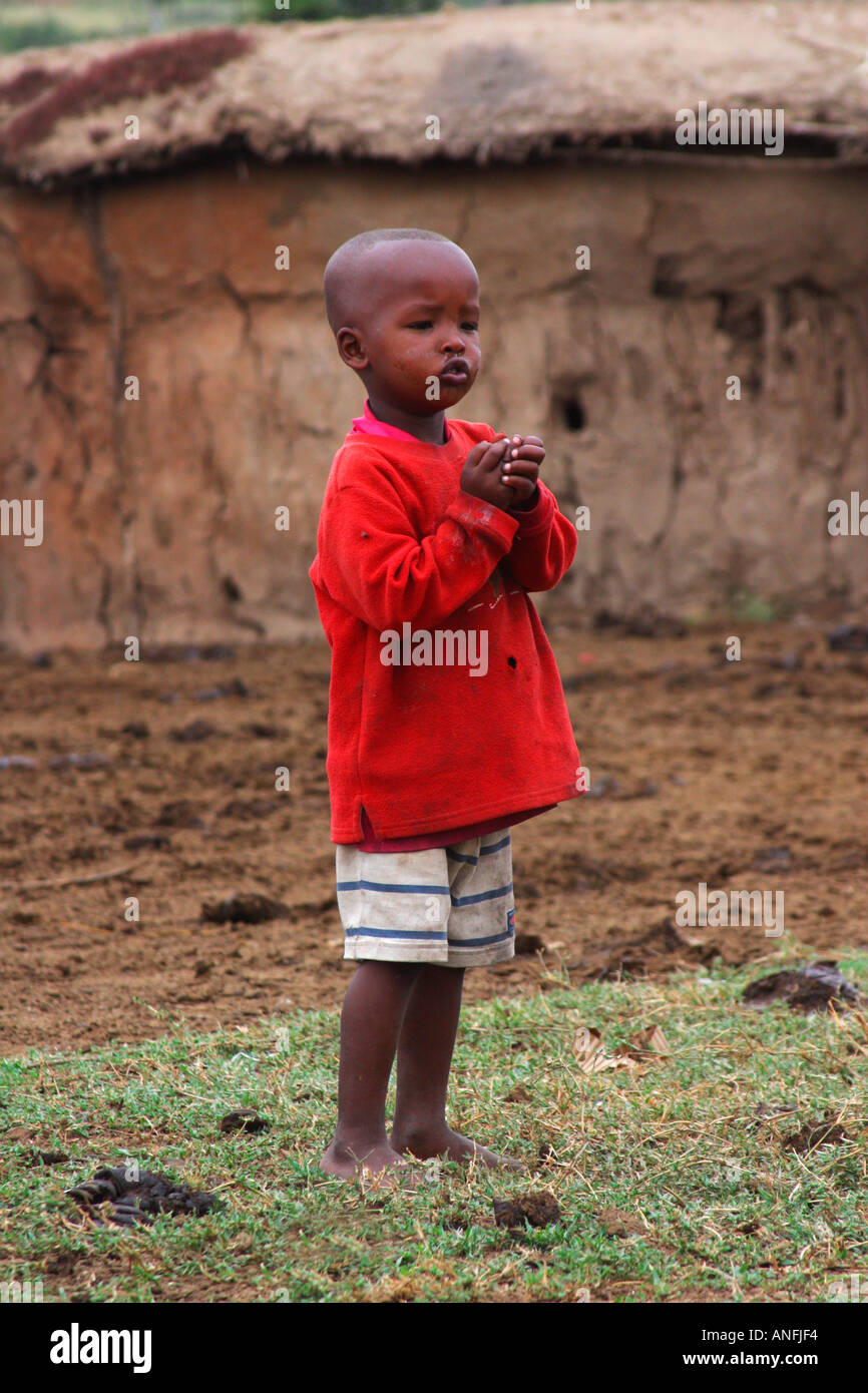 Maasai boy child in traditional village Masai Mara Kenya East Africa ...