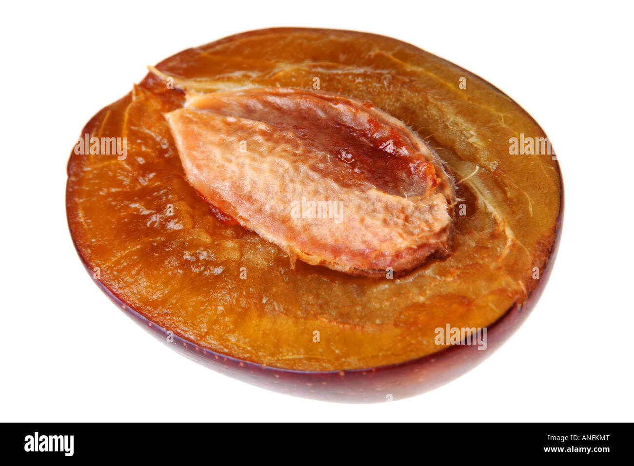 Closeup slice plum with seed on white background Stock Photo - Alamy