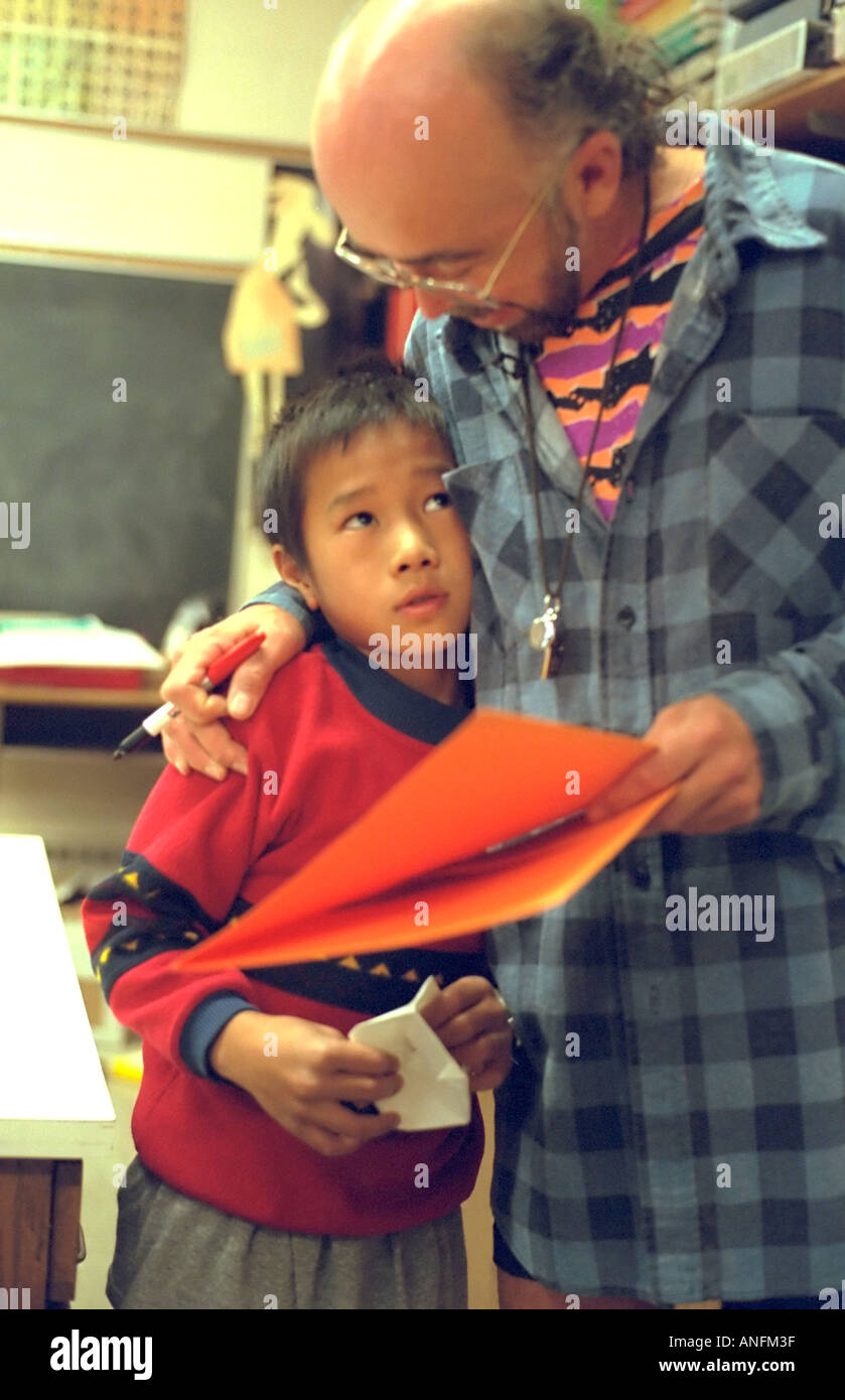 Teacher age 50 comforting frustrated summer school student age 9 ...