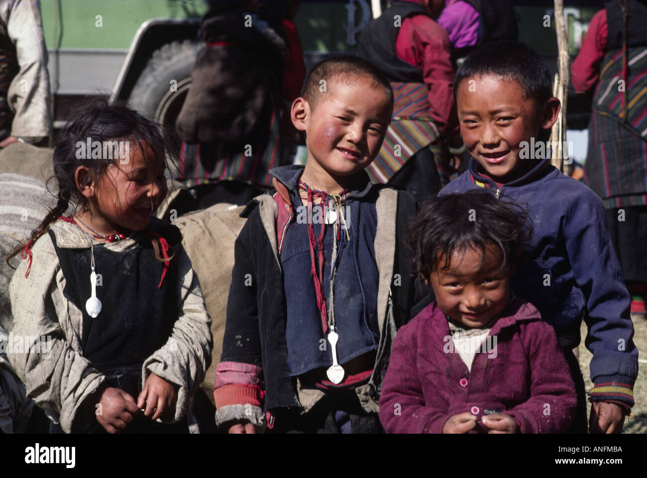 Landscape portrait of 5 poor Tibetan nomad children at a Buddhist ...