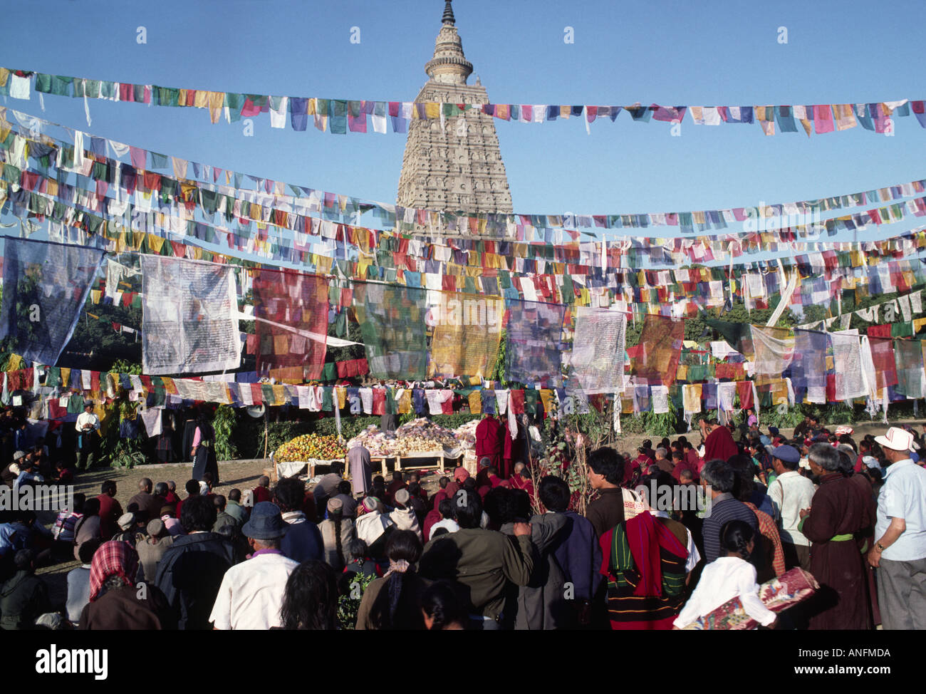 Buddhist pilgrims making offerings of food in front of the Mahabodhi ...