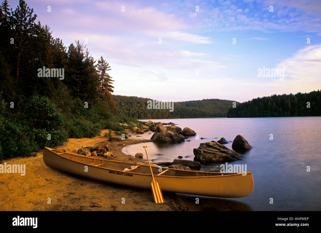 A canoe sits on the shoreline of a campsite on Booth Lake in Algonquin ...