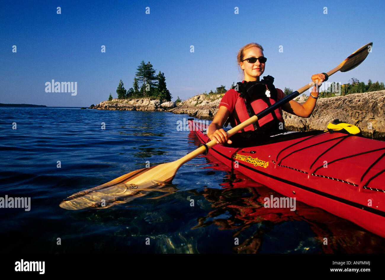Kayaker paddles on lake huron in five national marine park hi-res stock ...