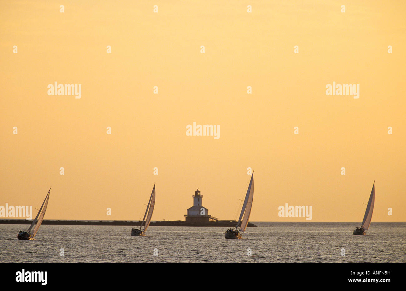 Sailboats racing near Schurman's Point with Indian Head Lighthouse in ...