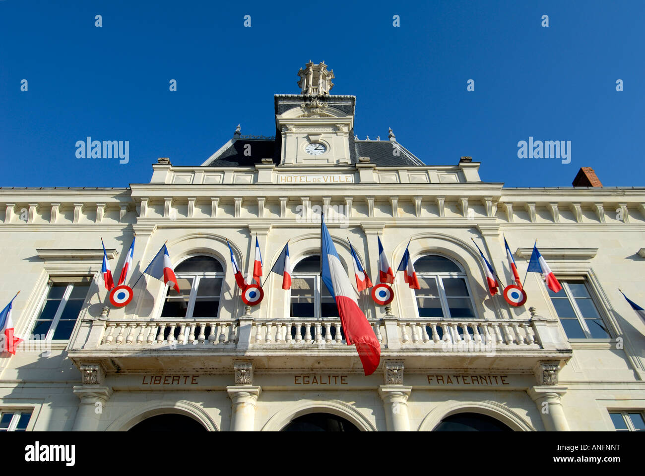 French Tricolour flags on town hall, Chatellerault, Vienne, France ...