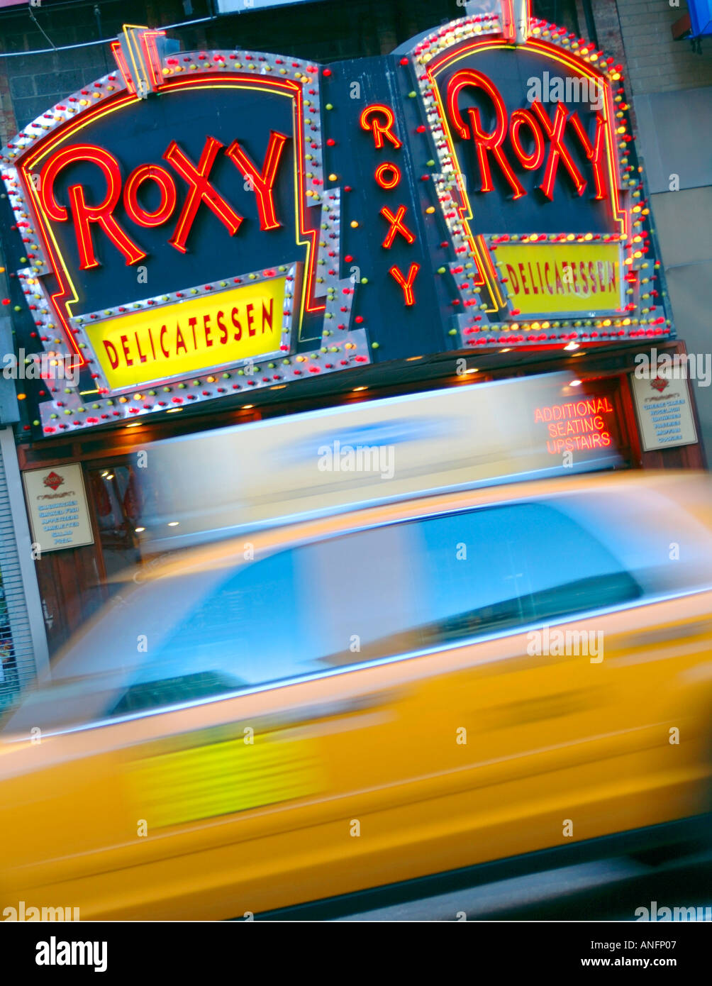 Sign of the famous Roxy delicatessen restaurant with blurred passing ...