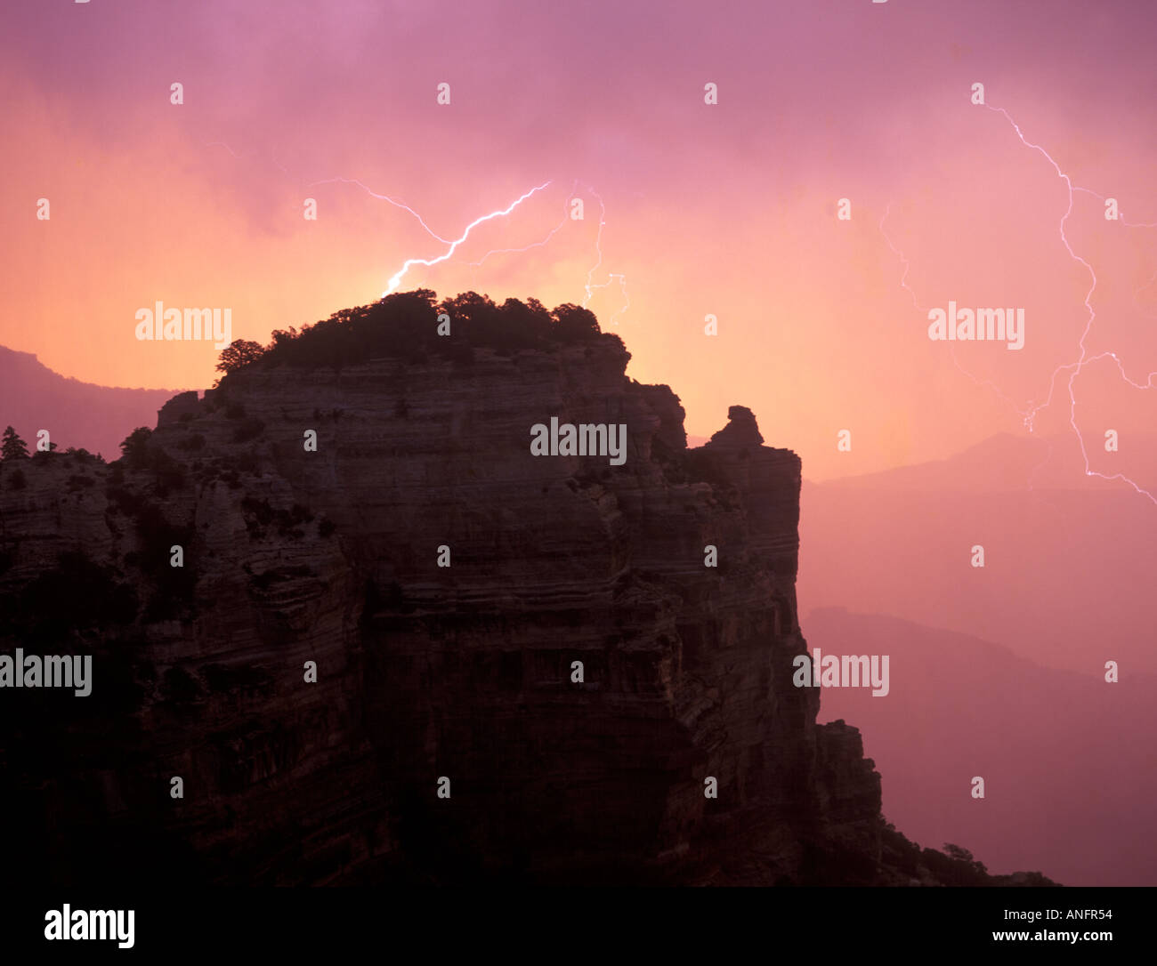 Lightening striking rock in dawn thunderstormWahalia Overlook North Rim ...