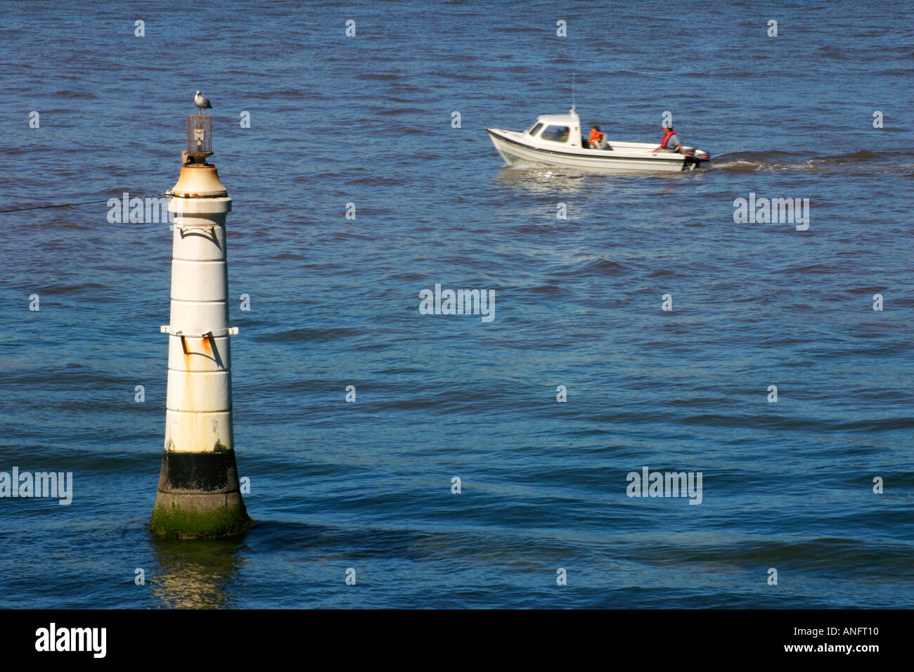 Harbour light and boat at Shaldon Devon Stock Photo - Alamy