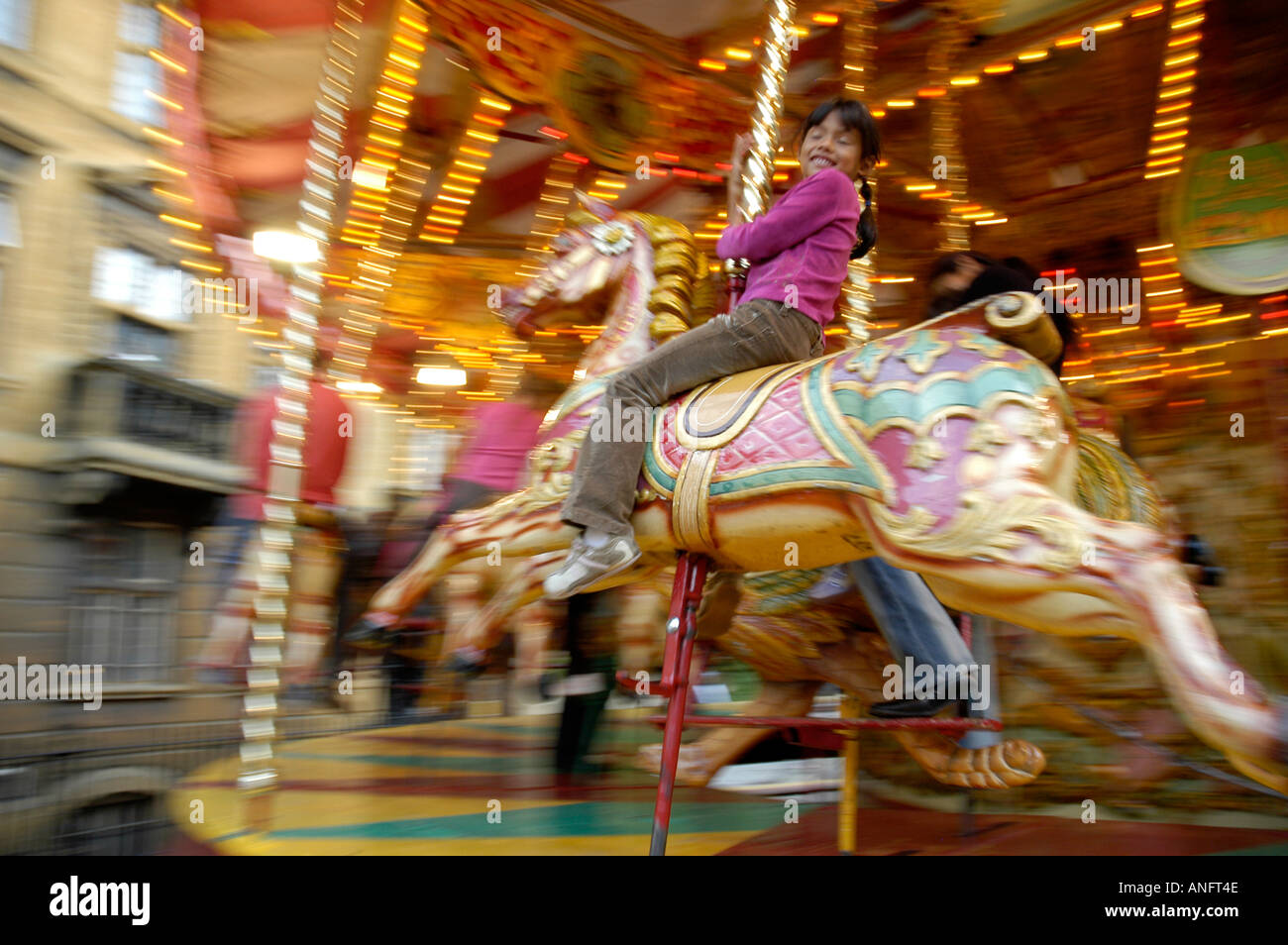 Family fun on the traditional merry go round roundabout at St Giles ...