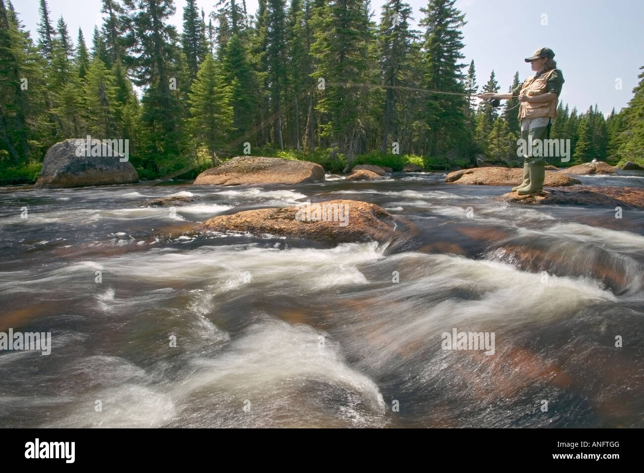 young lady fishing on Viking Trail, Tuckamore Lodge, Salmon Pool, near ...