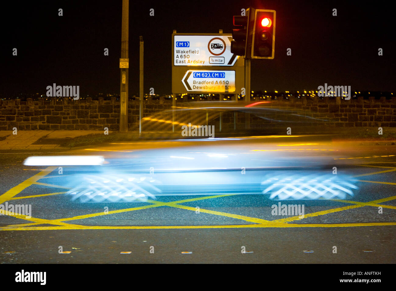 Blurry speeding car at night Stock Photo - Alamy