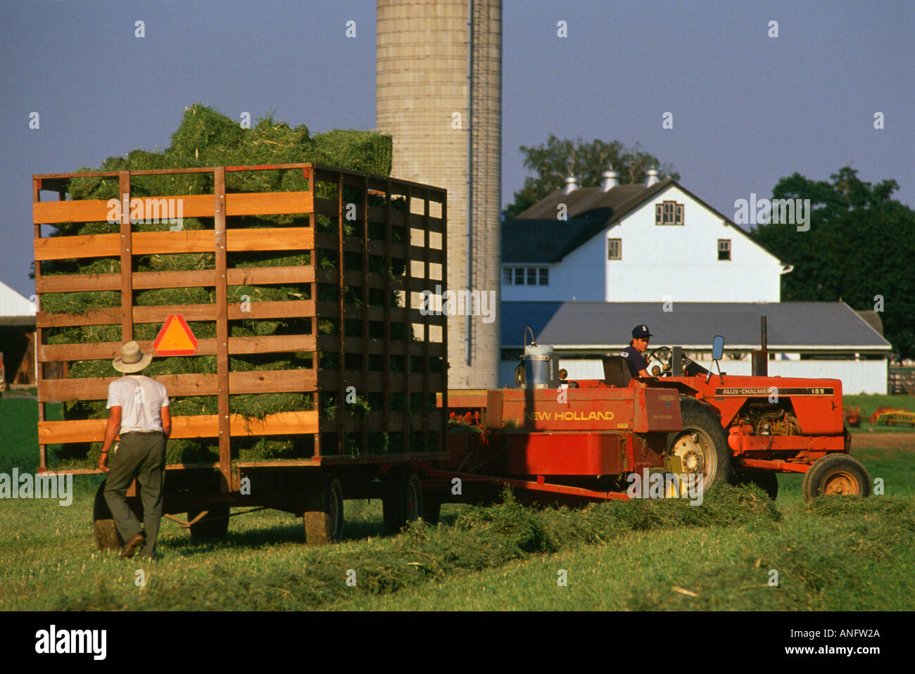 Tractor bailing hay in farm hi-res stock photography and images - Alamy
