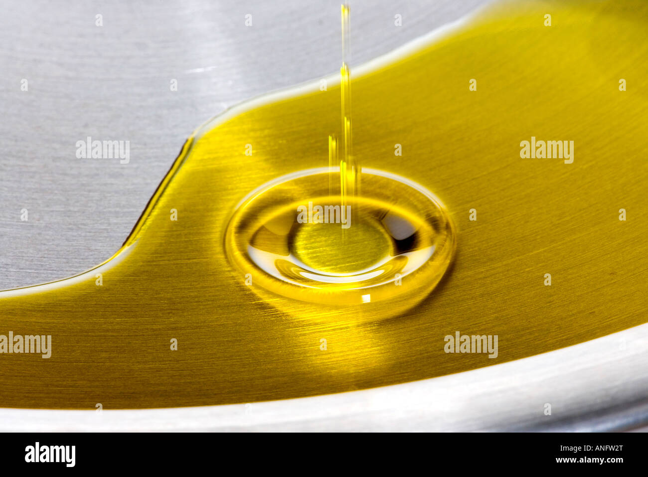 Oil pouring on spoon Stock Photo - Alamy