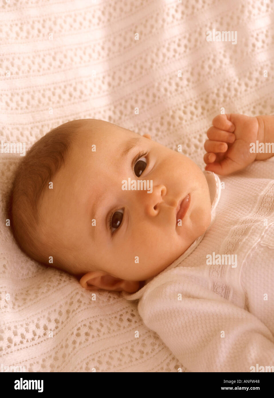 Baby girl looking up Stock Photo - Alamy