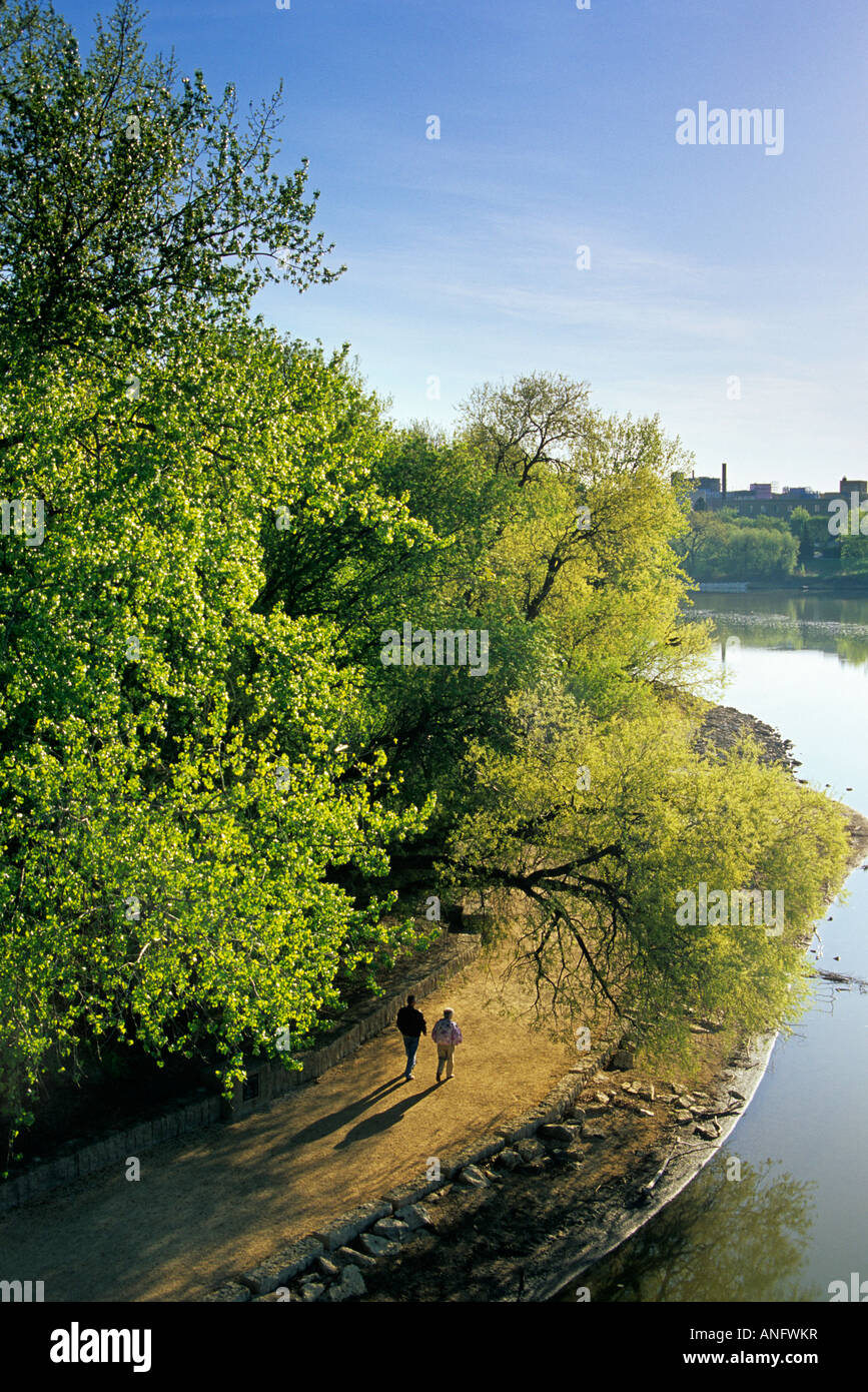 Along river walkway following Red River, Forks National Historic Site ...