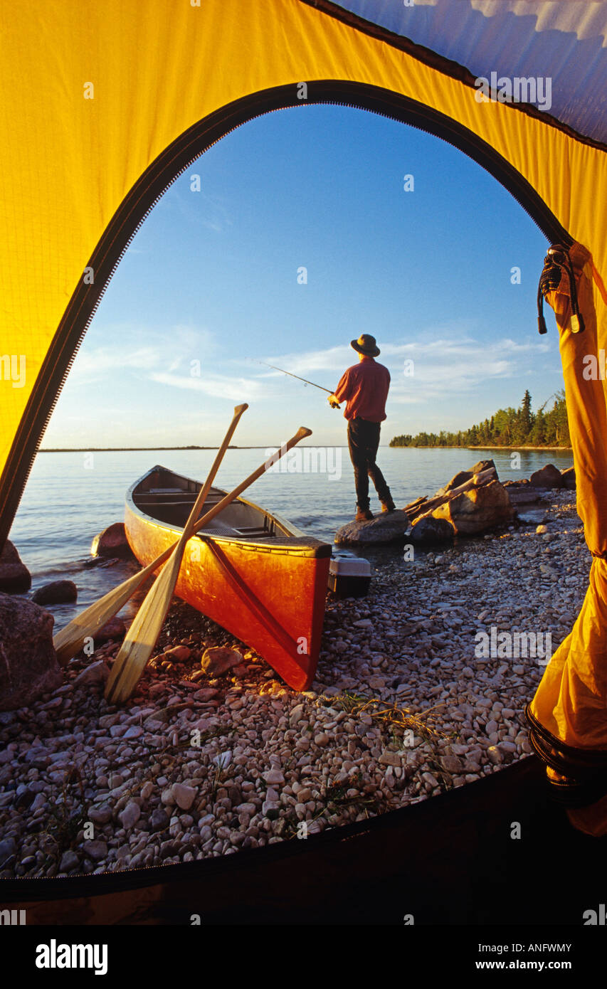 View from tent of twenty year old fishing along Little Limestone Lake ...